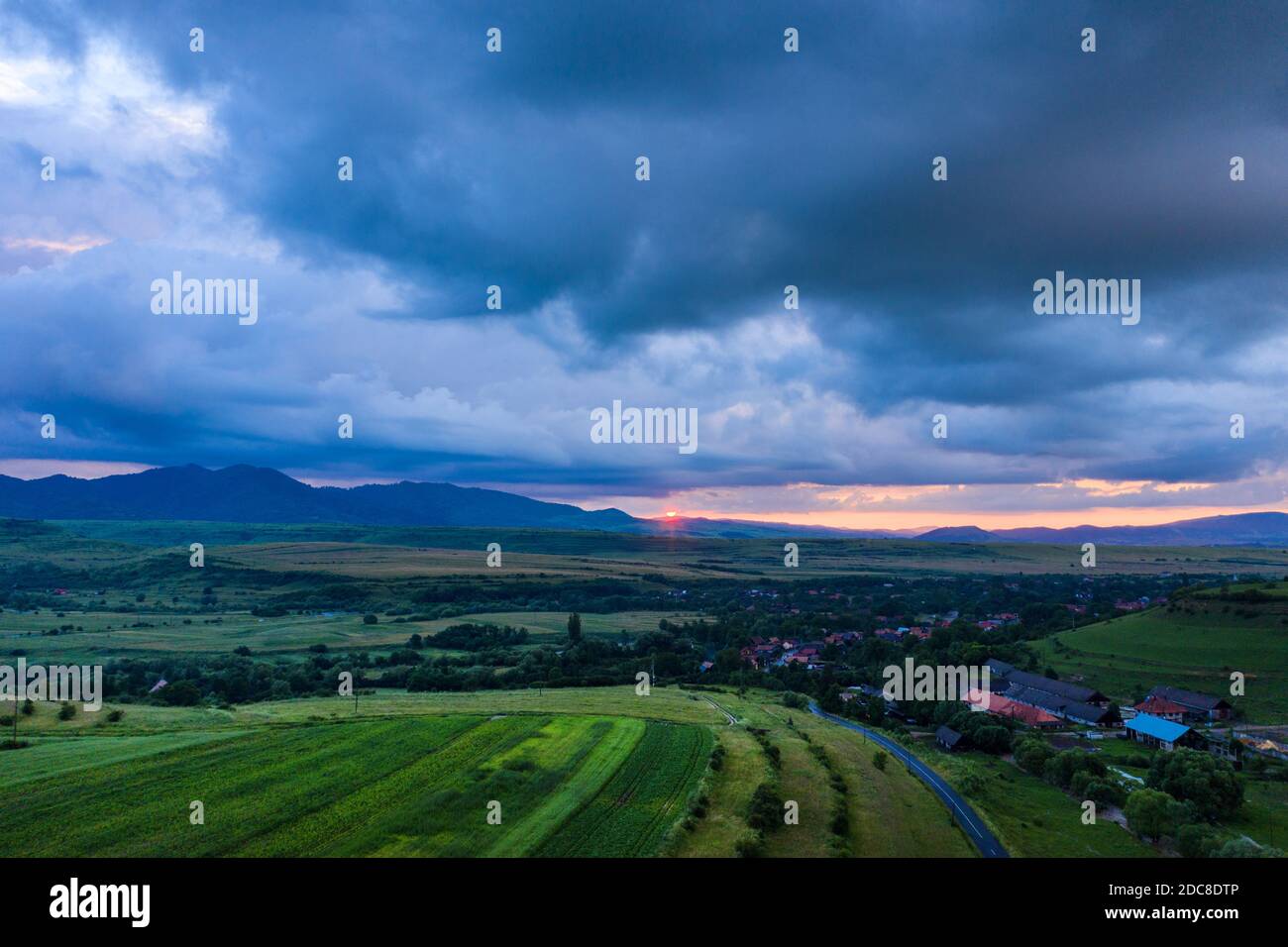 Aerial view of a storm and clouds above a village road Stock Photo - Alamy