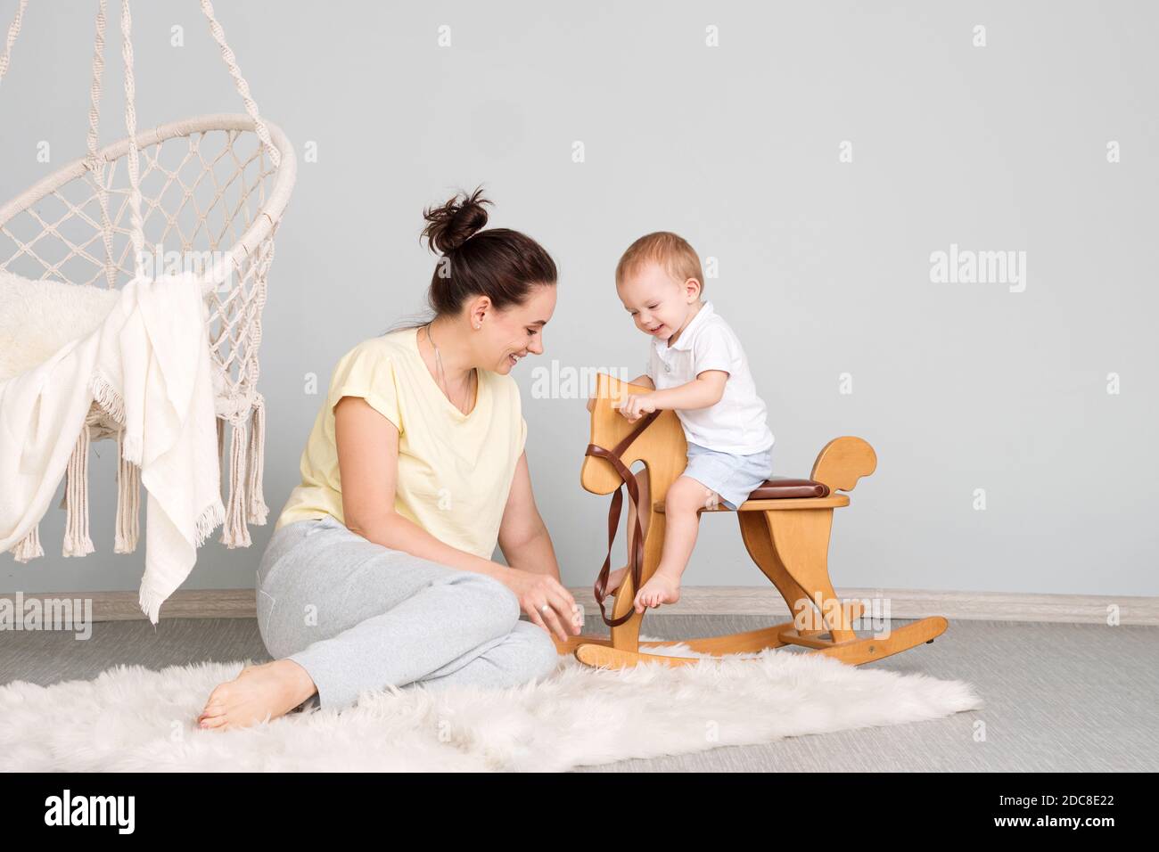 Woman rocking horse hi-res stock photography and images - Alamy