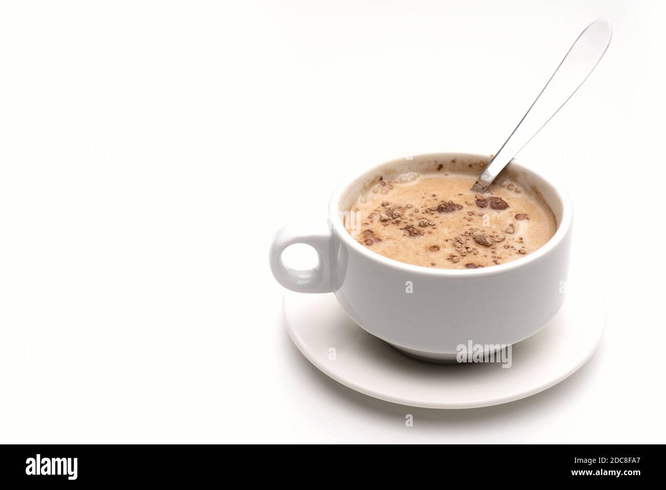 Cup of cocoa with lumps on white background Stock Photo - Alamy