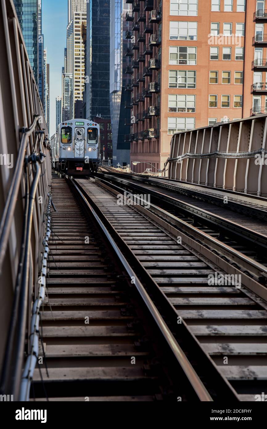 Urban city commuter train tracks among skyscrapers Stock Photo - Alamy