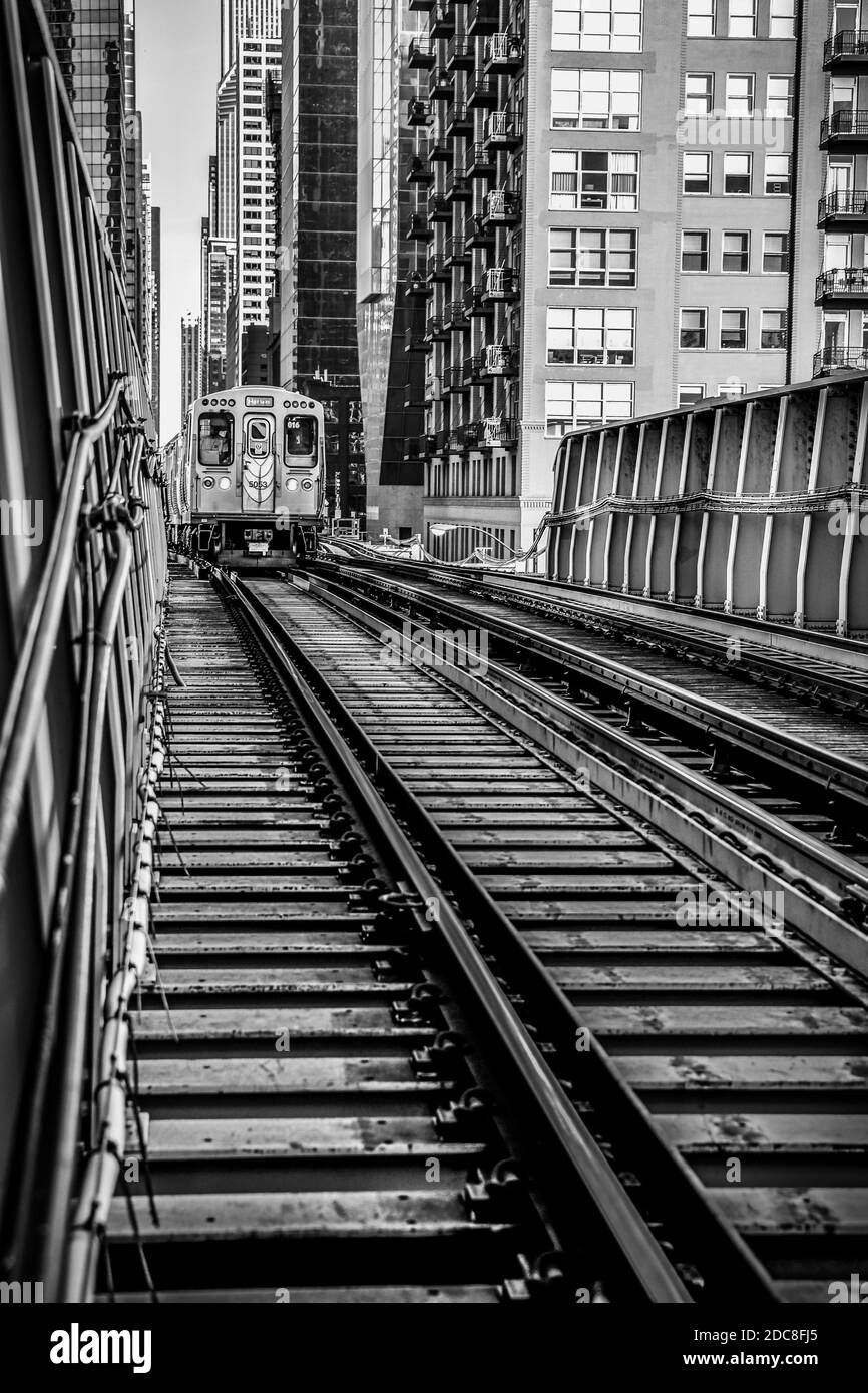 Urban city commuter train tracks among skyscrapers Stock Photo - Alamy