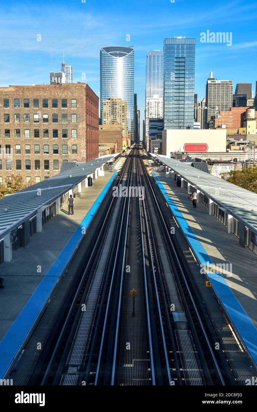 Urban city commuter train tracks among skyscrapers Stock Photo - Alamy