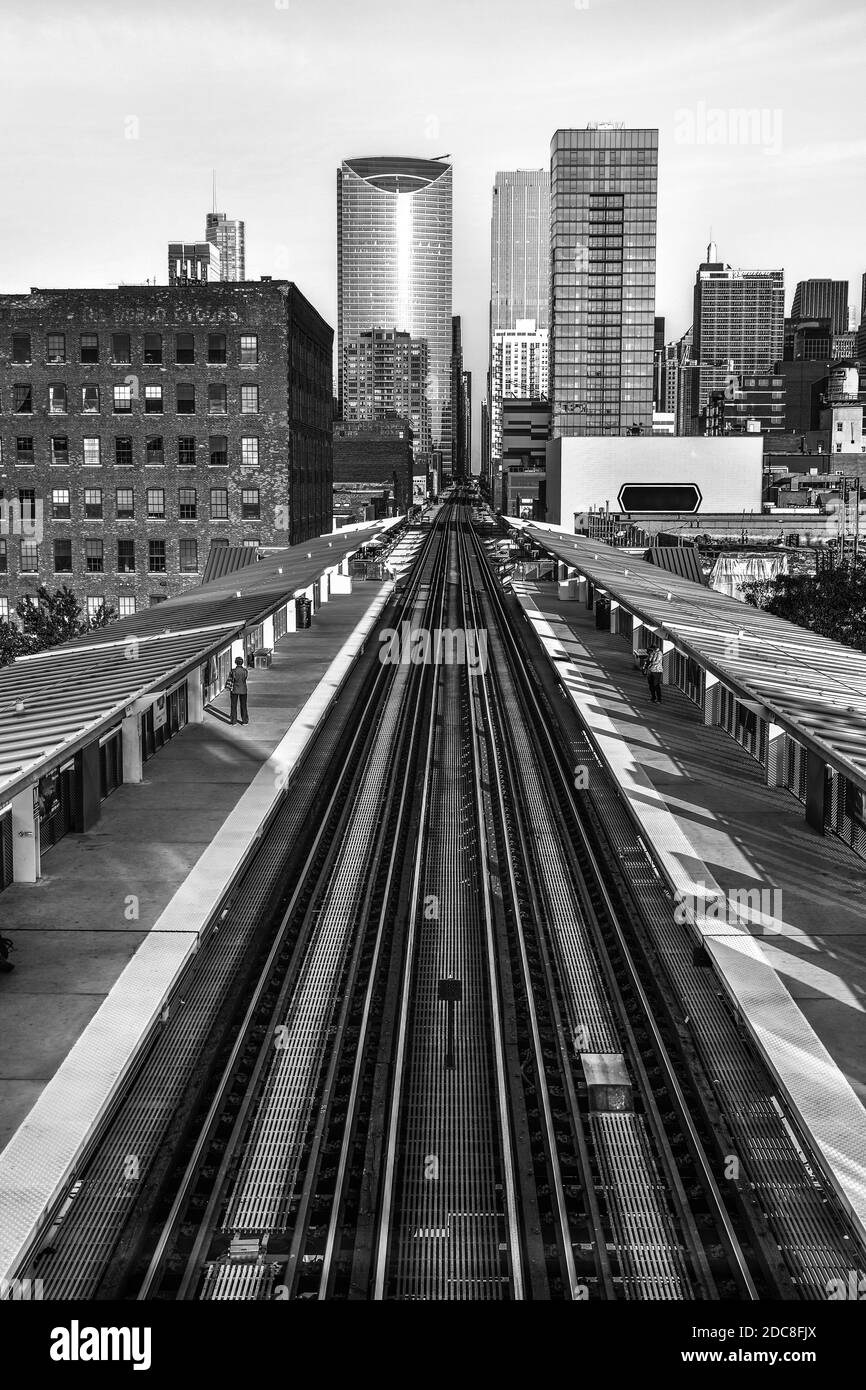 Urban city commuter train tracks among skyscrapers Stock Photo - Alamy