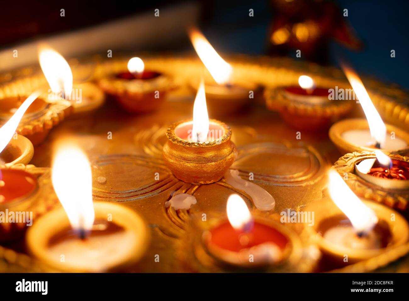 Macro shot showing colorful earthenware diya oil lamps with a little ...