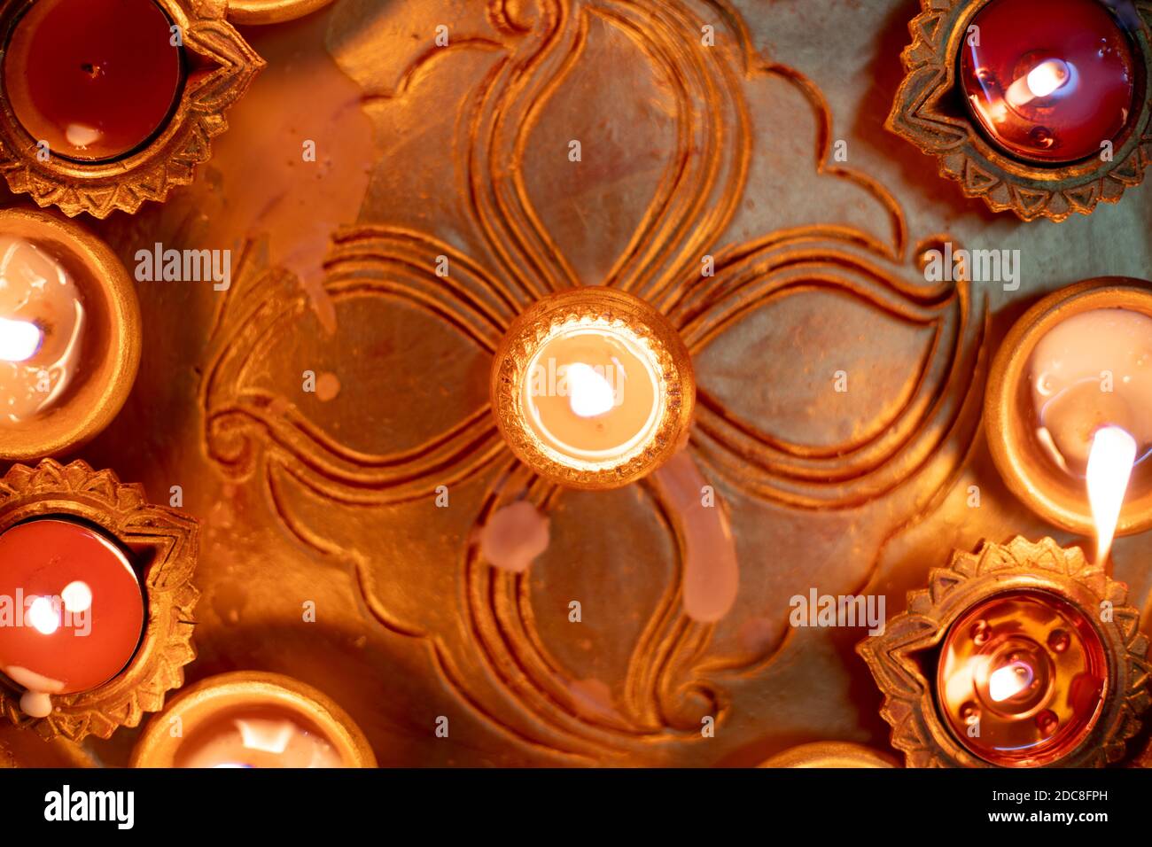 Macro shot showing colorful earthenware diya oil lamps with a little ...