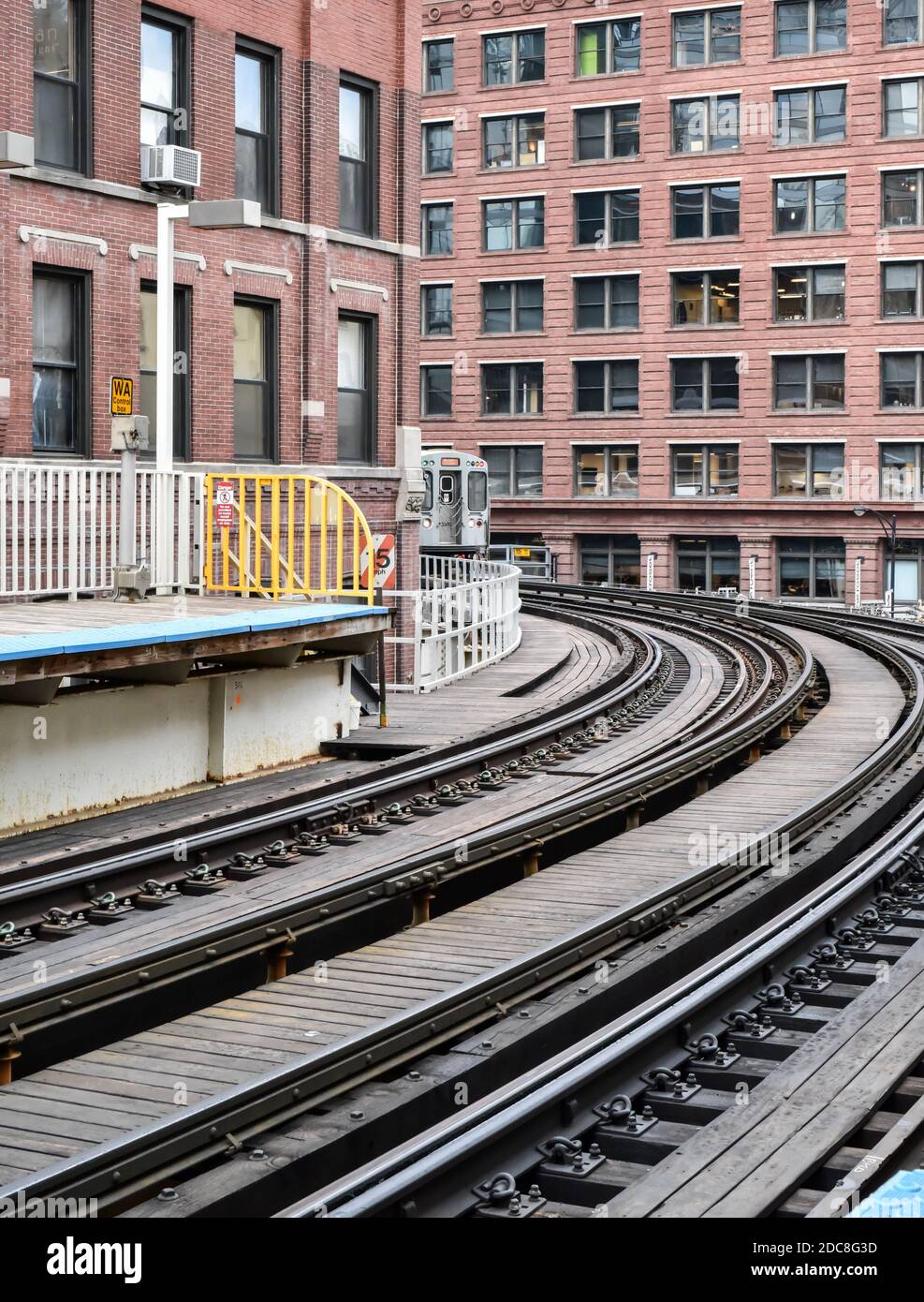 Urban city commuter train tracks among skyscrapers Stock Photo - Alamy
