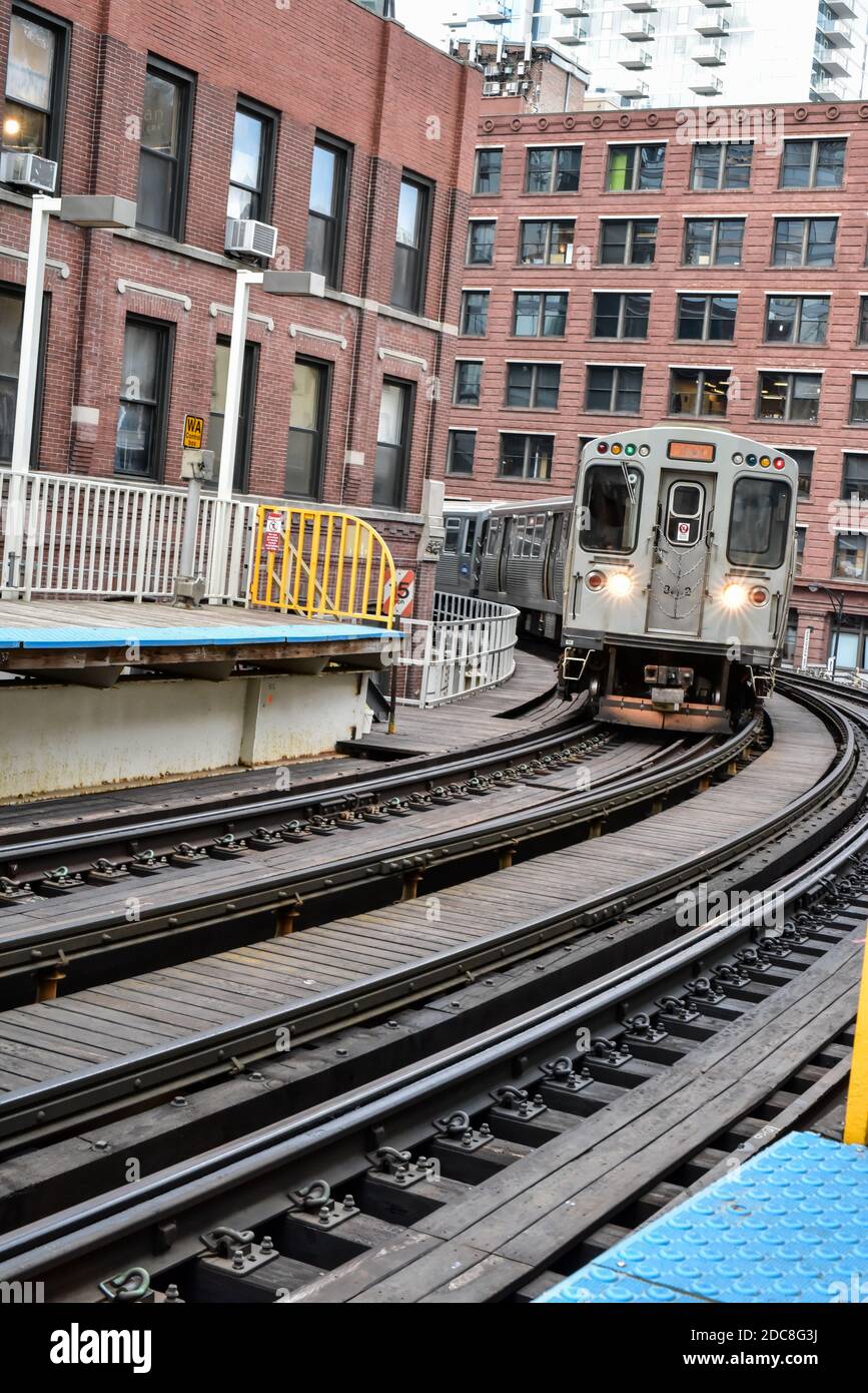 Urban city commuter train tracks among skyscrapers Stock Photo - Alamy