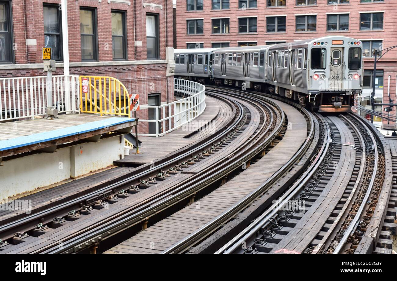 Urban city commuter train tracks among skyscrapers Stock Photo - Alamy