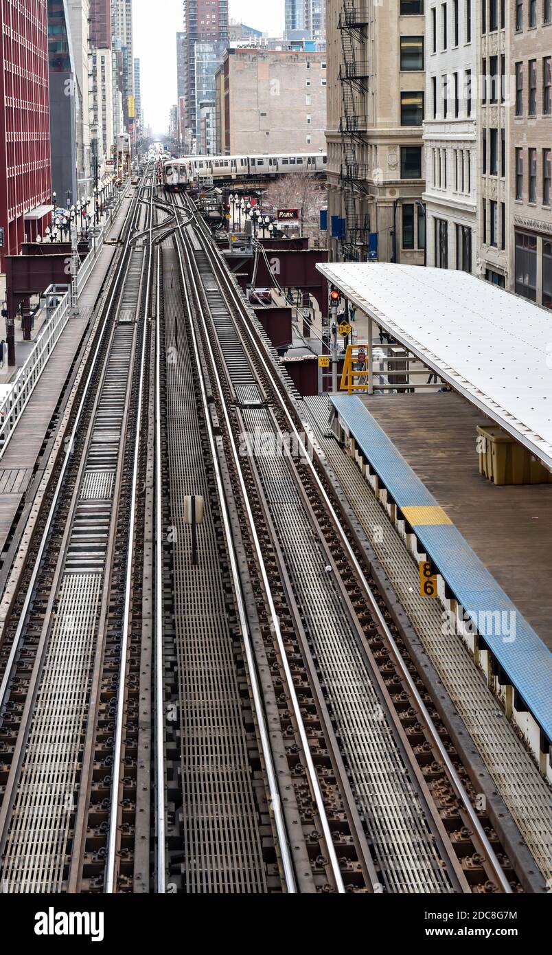 Urban city commuter train tracks among skyscrapers Stock Photo - Alamy