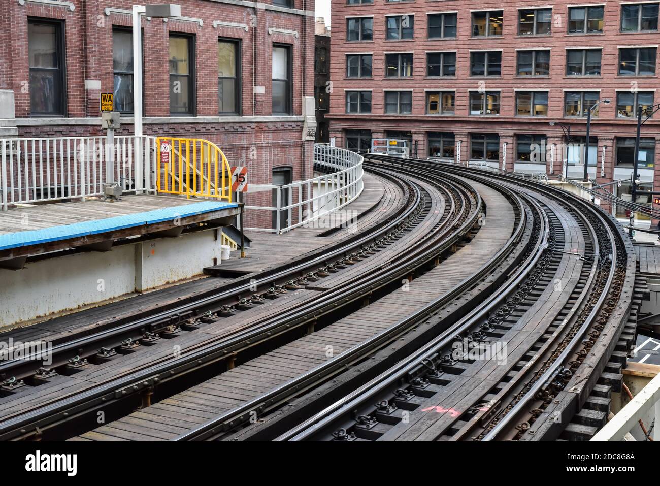 Urban city commuter train tracks among skyscrapers Stock Photo - Alamy