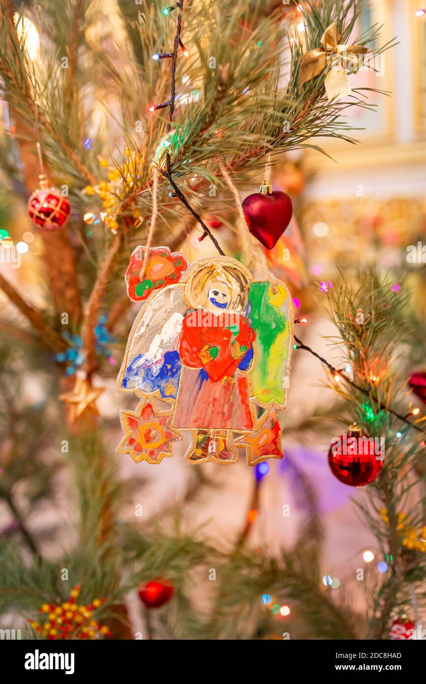 Decorated Christmas tree with toy angel in Orthodox church. Merry ...