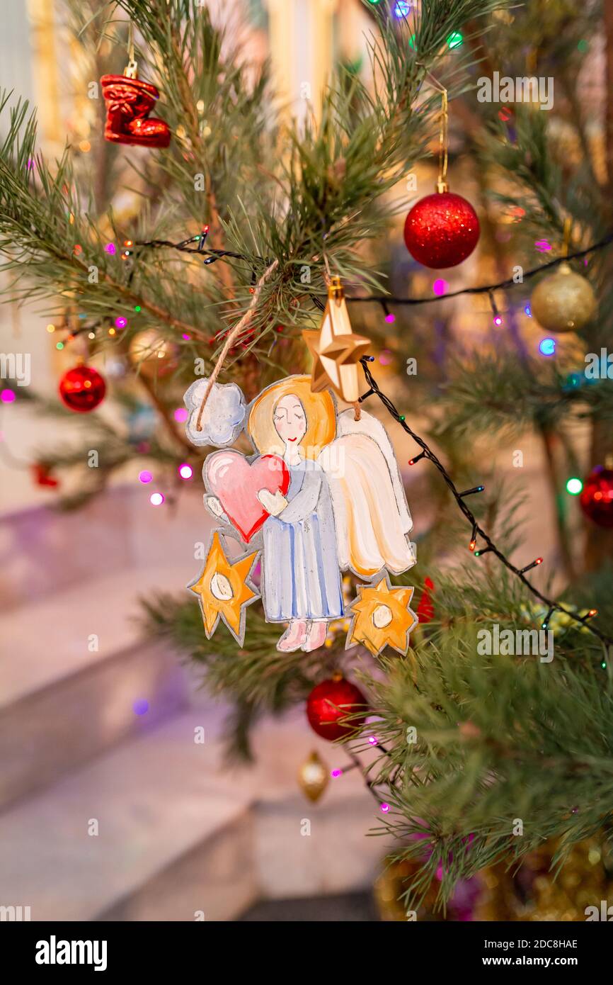 Decorated Christmas tree with toy angel in Orthodox church. Merry ...