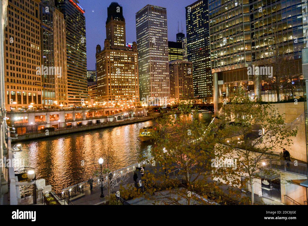 Big city skyline lights at night with river running through Stock Photo ...