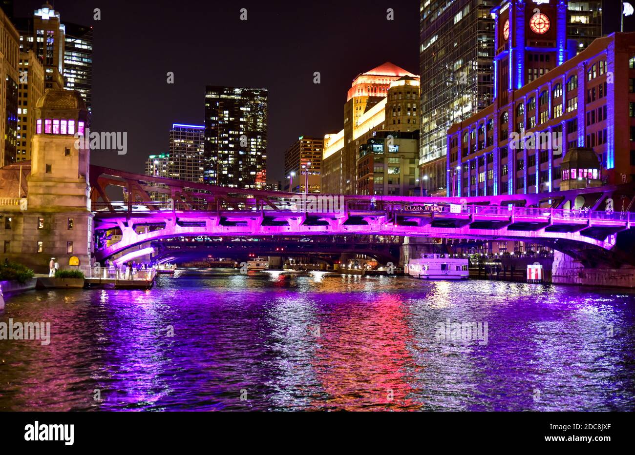 Big city skyline lights at night with river running through Stock Photo ...