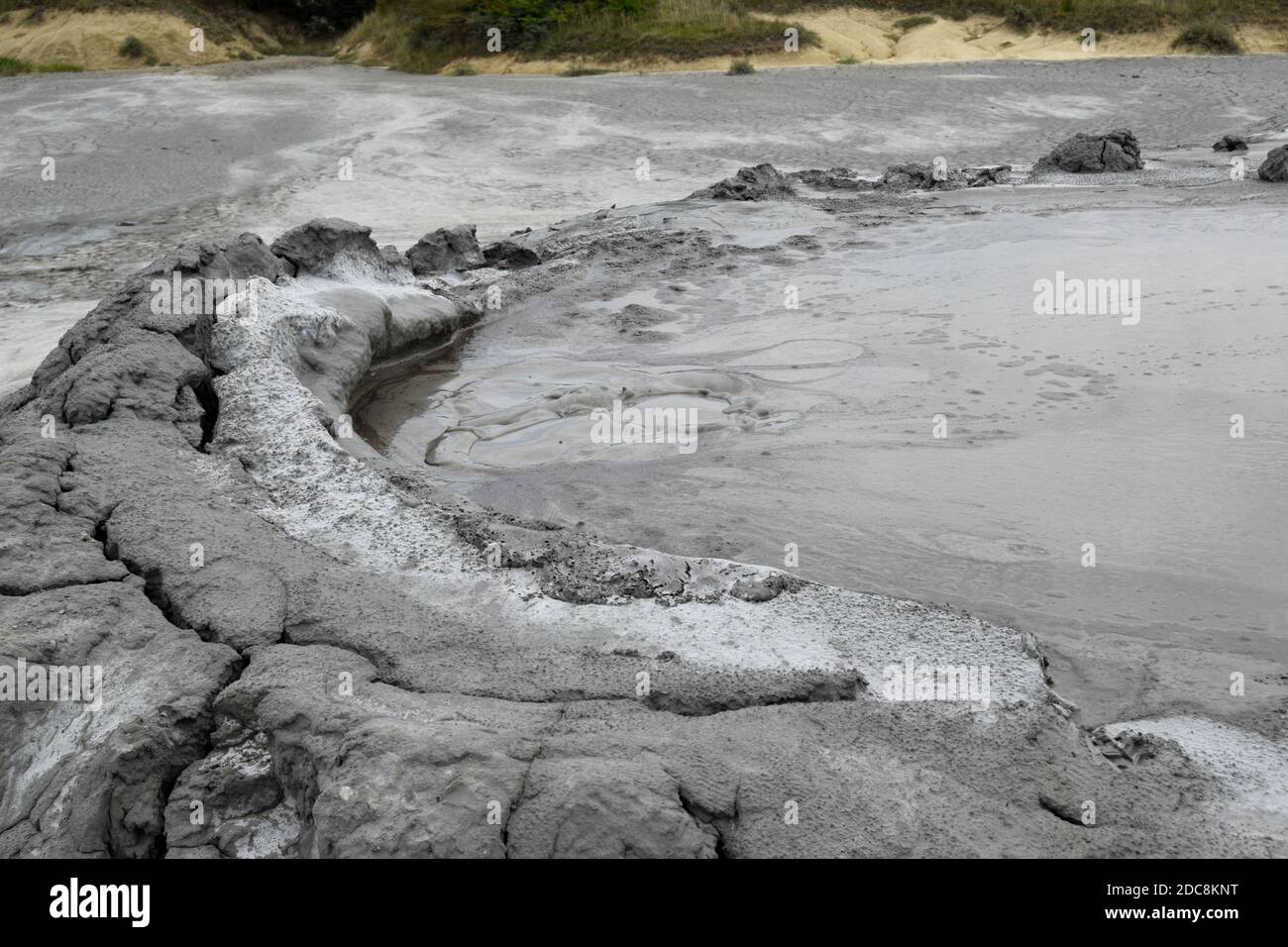 Bubbling crater of a mud volcano. Close up view onto gas bubble ...