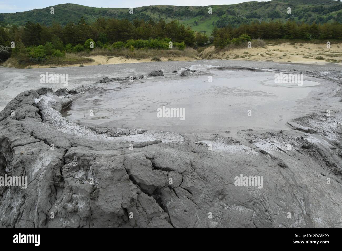 Bubbling crater of a mud volcano. Close up view onto gas bubble ...