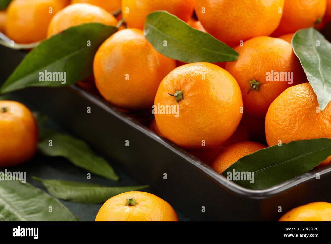 Fresh mandarin oranges with leaves, close up view. Seasonal fruits ...