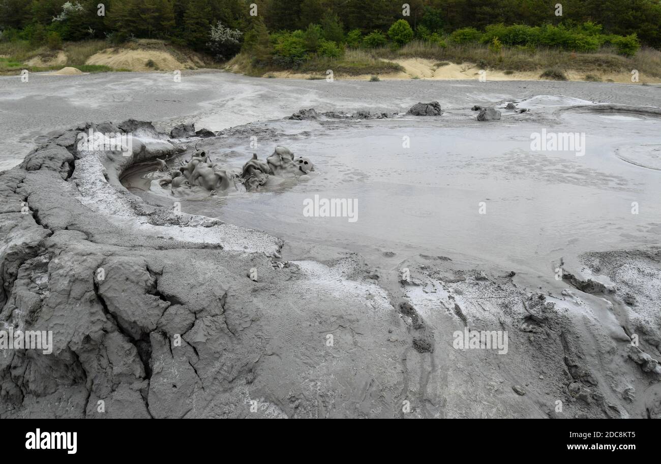 Bubbling crater of a mud volcano. Close up view onto gas bubble ...