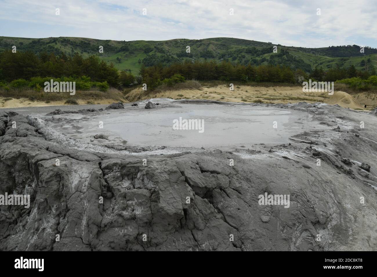 Bubbling crater of a mud volcano. Close up view onto gas bubble ...