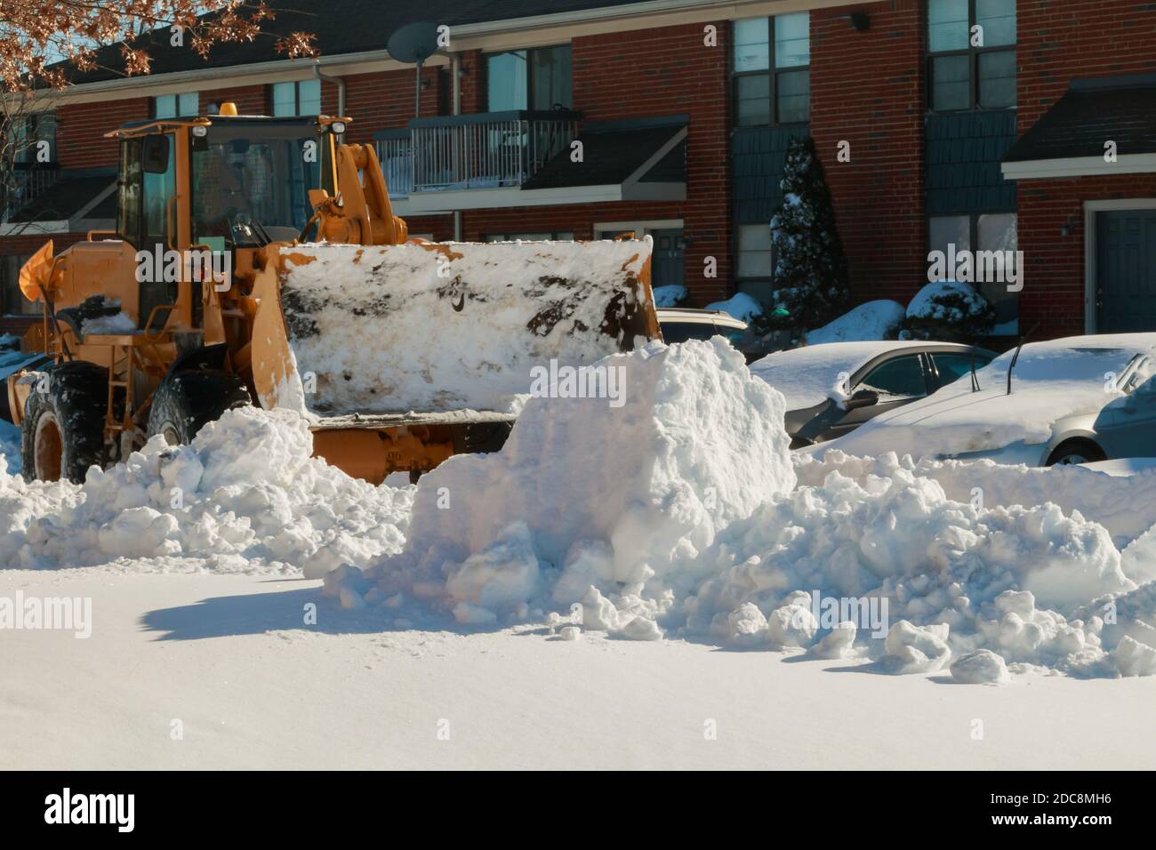 Snow plough truck clearing road after winter snowstorm blizzard for ...