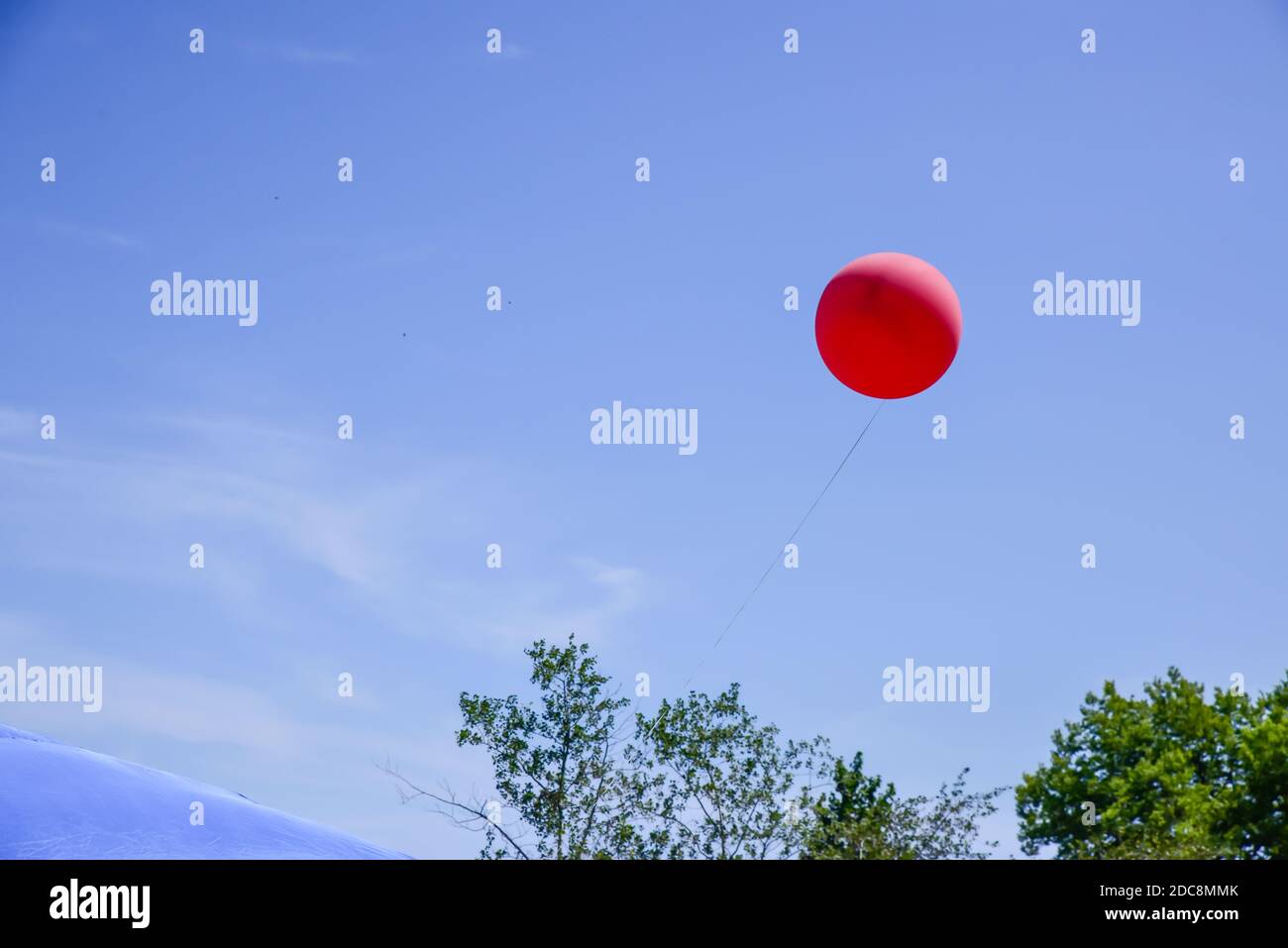 single red balloon floating the air against blue sky in summer Stock ...