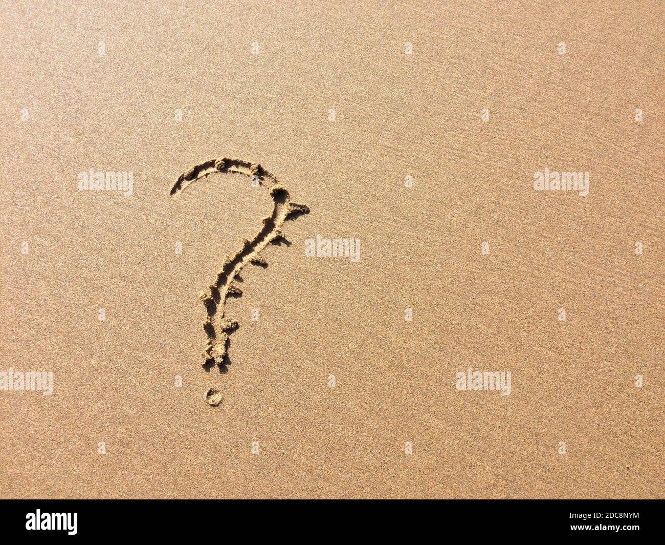 question mark drawn in the sand, a symbol of mystery and riddles Stock ...