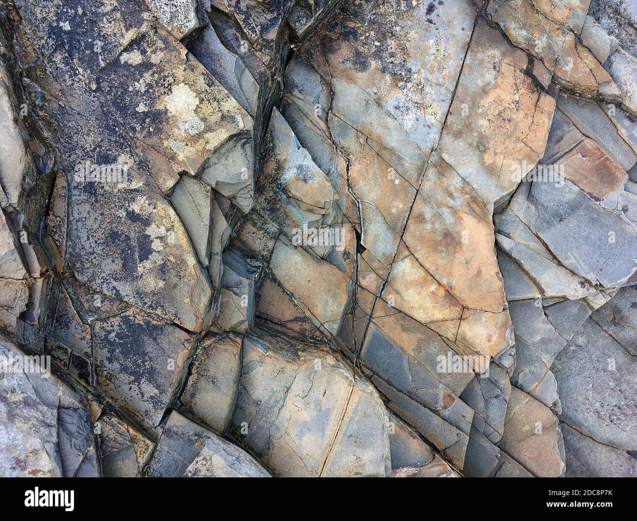 fractured rock strata as a background, cracked rock, stone texture ...