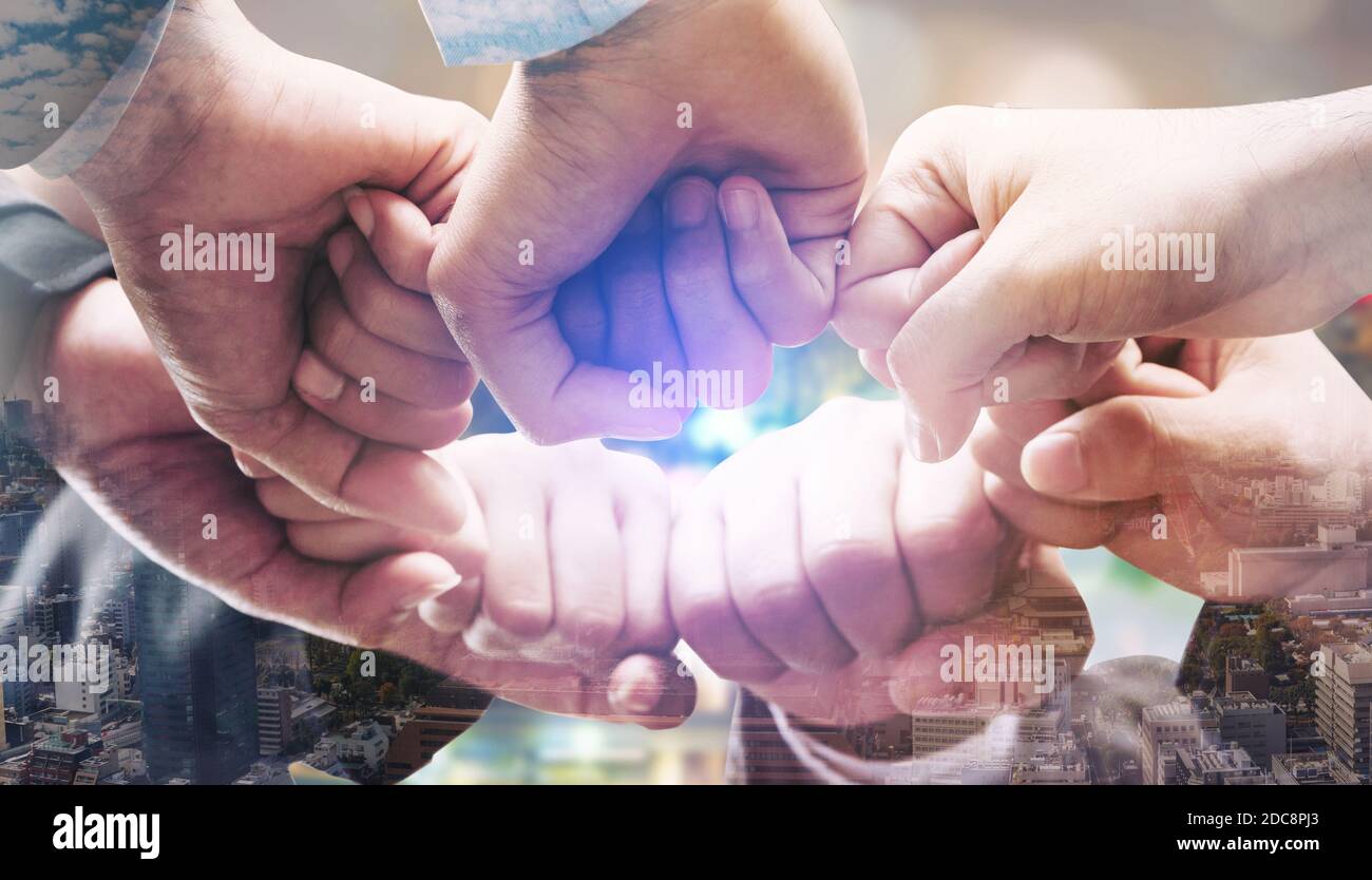 Business people team joining hands showing teamwork, collaboration and ...
