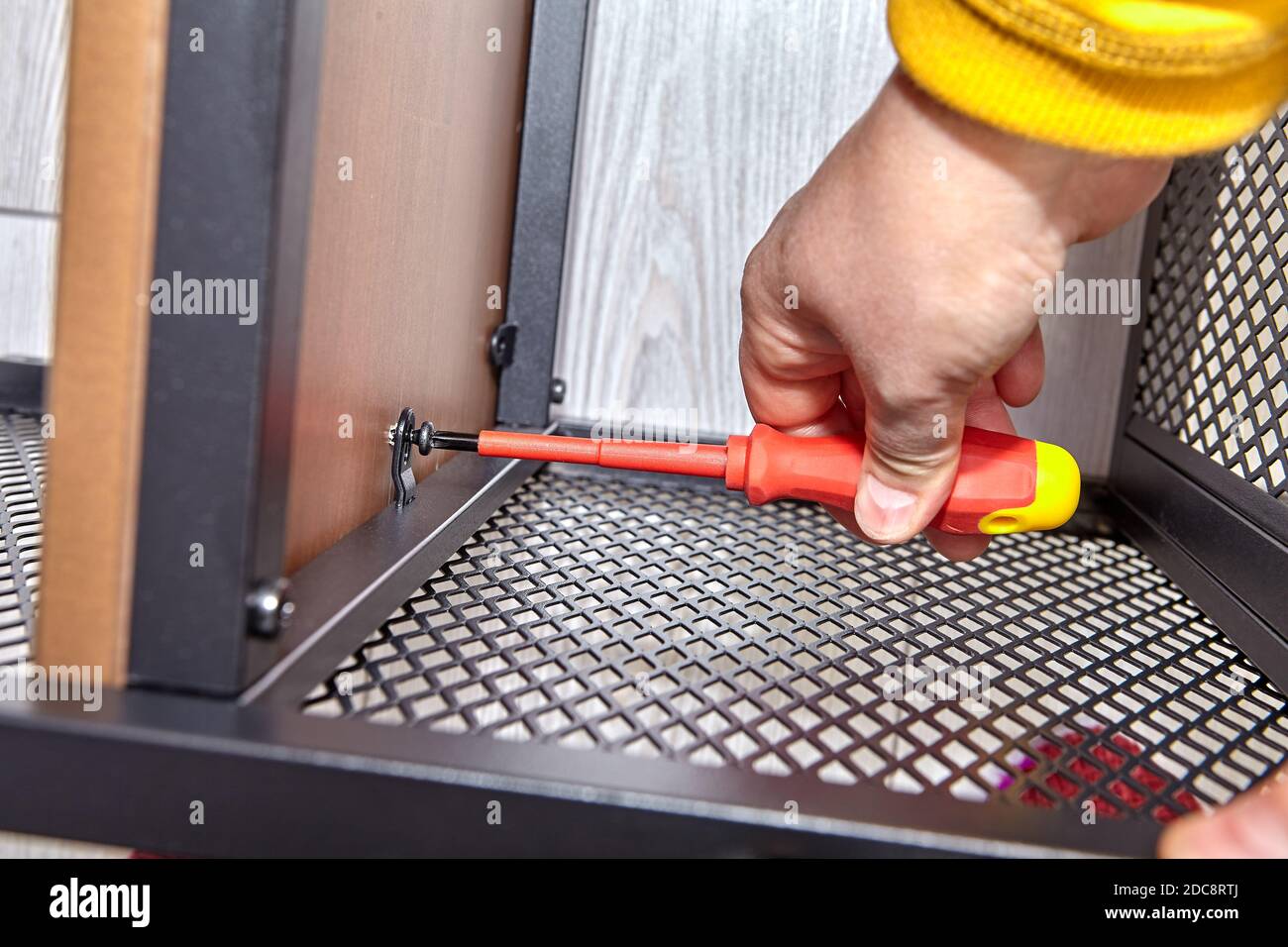 Assembling Of Metal Flat Pack Furniture By Handyman Assembler Is