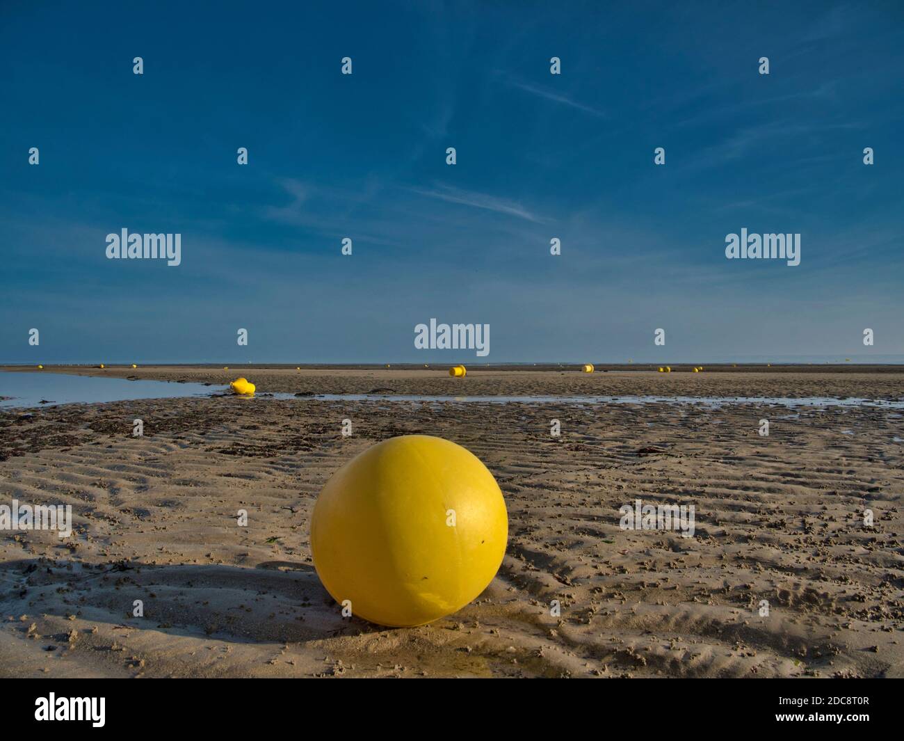 Yellow on the beach Stock Photo - Alamy