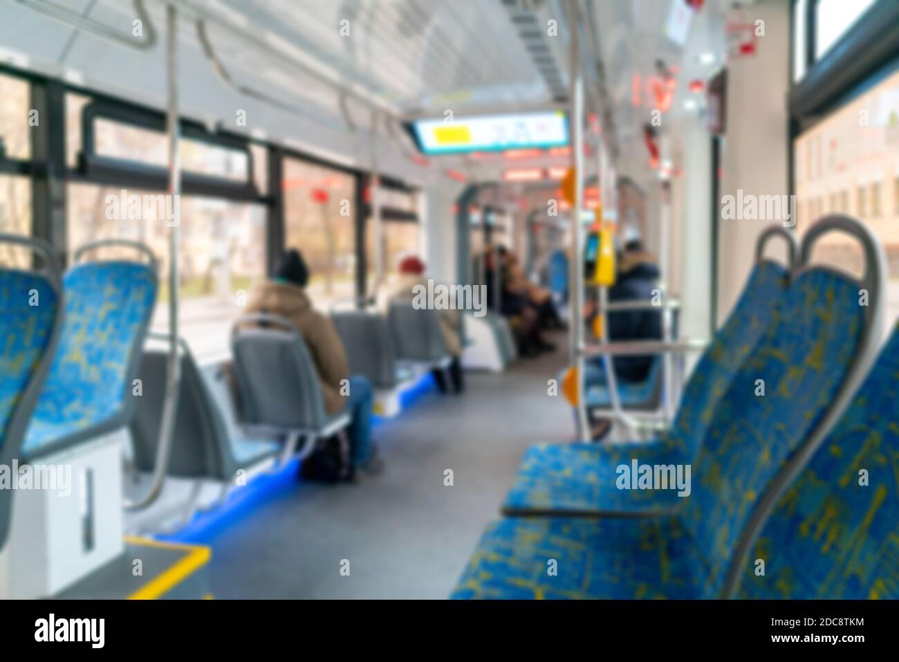 Blurred background of tram interior with passengers Stock Photo - Alamy