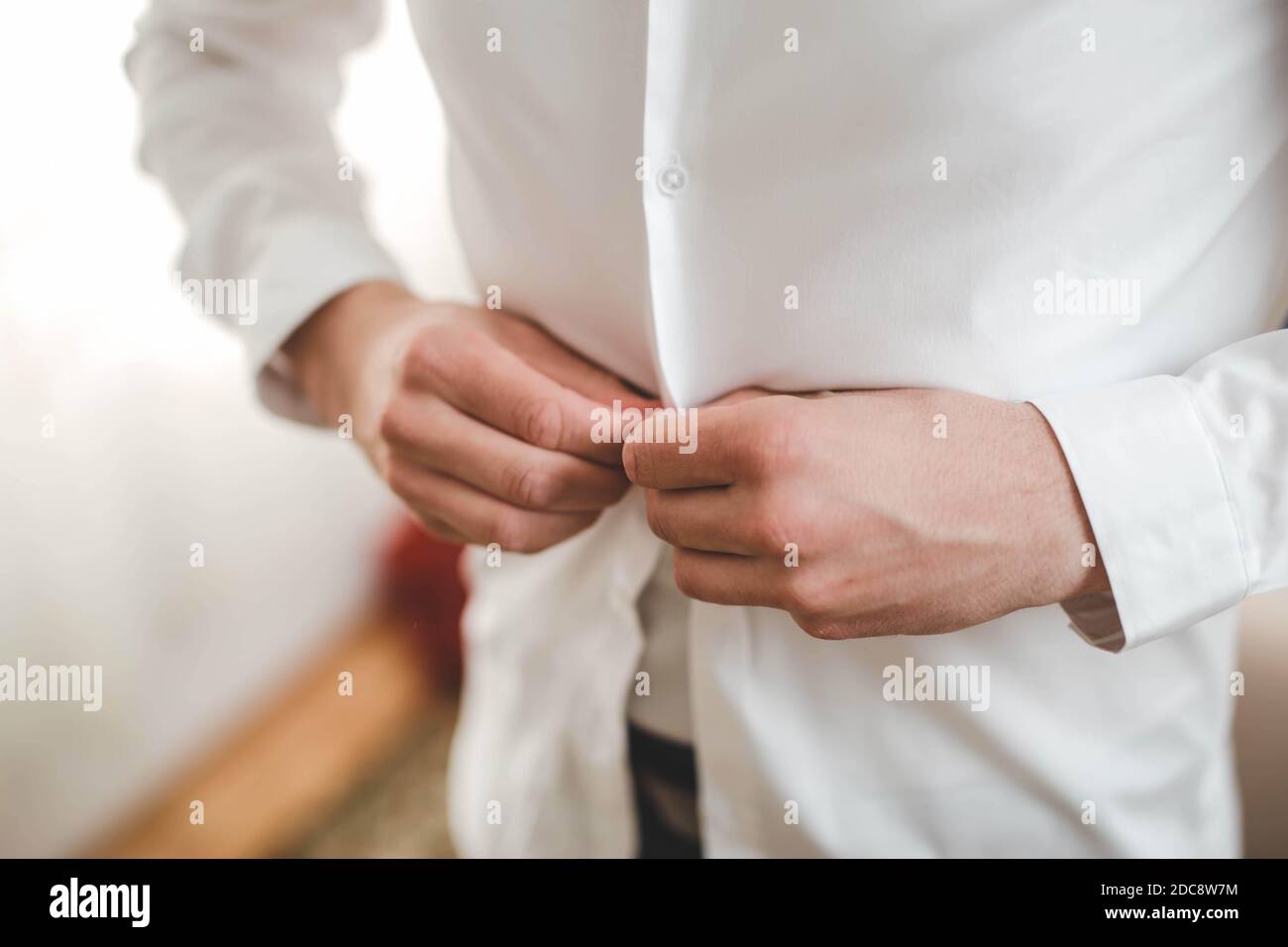 A closeup of a groom getting ready for the wedding ceremony Stock Photo ...