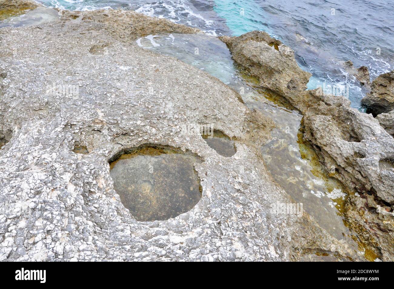 Tropical small secret pristine pebble beach surrounded by rocks ...