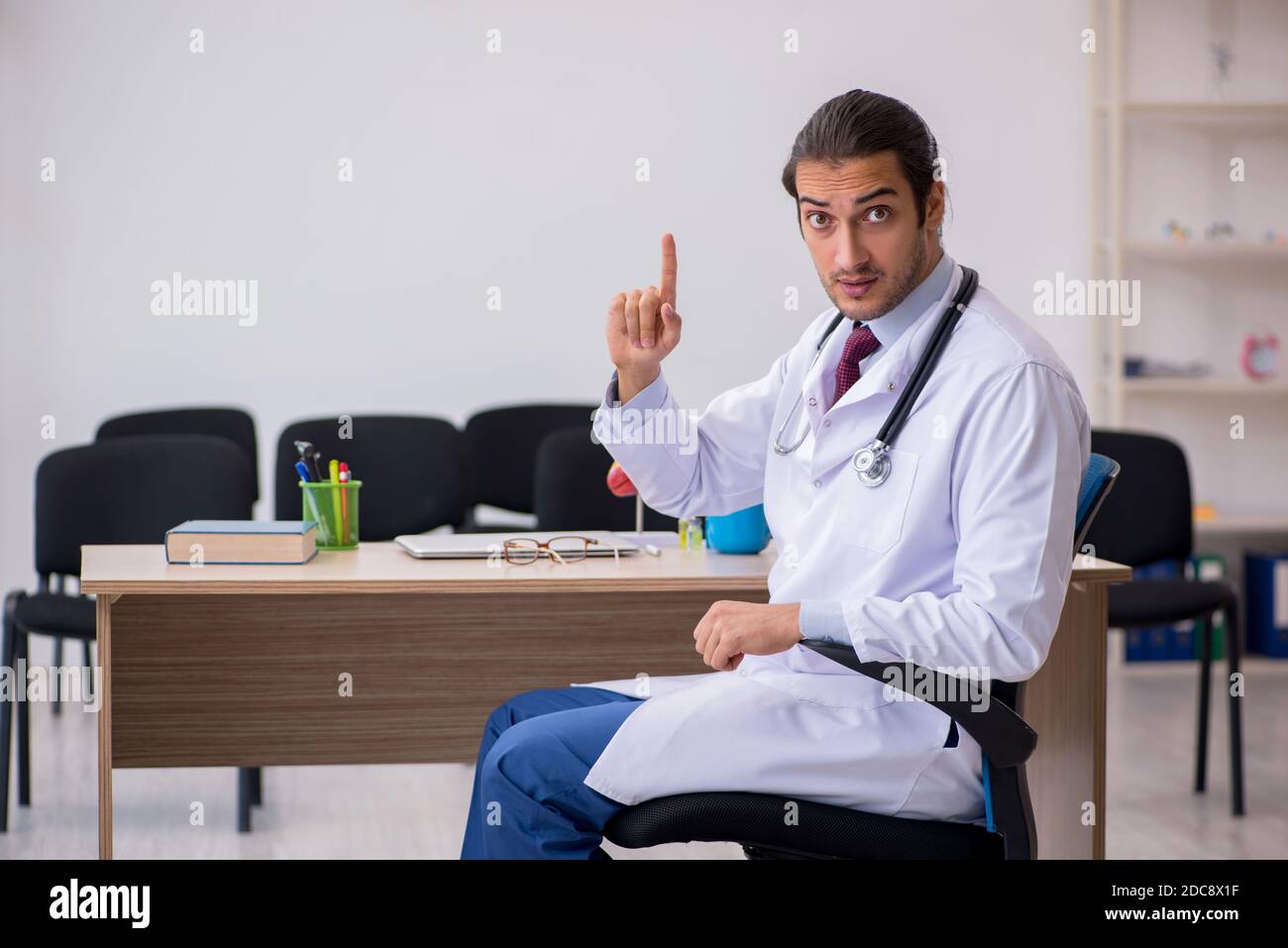 Young doctor giving seminar in the classroom Stock Photo - Alamy