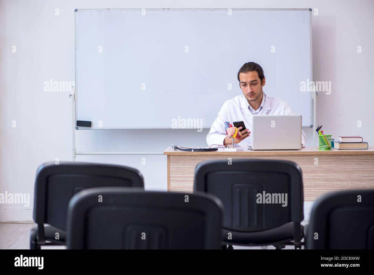 Young doctor giving seminar in the classroom Stock Photo - Alamy