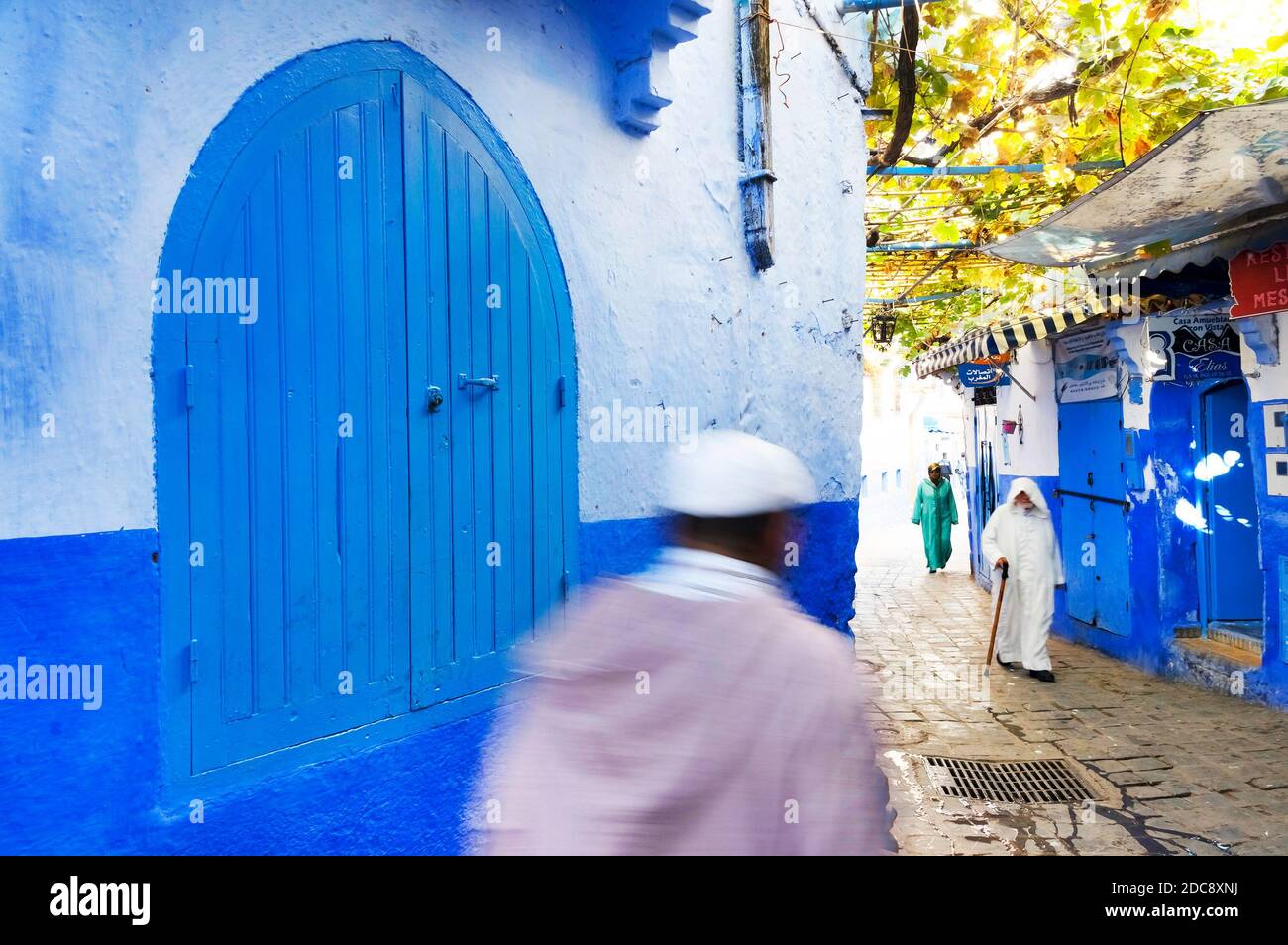 Street life in the Blue city of Chefchaouen, one of the tourist ...