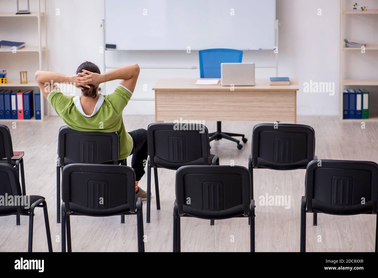 Young student in business presentation concept Stock Photo - Alamy