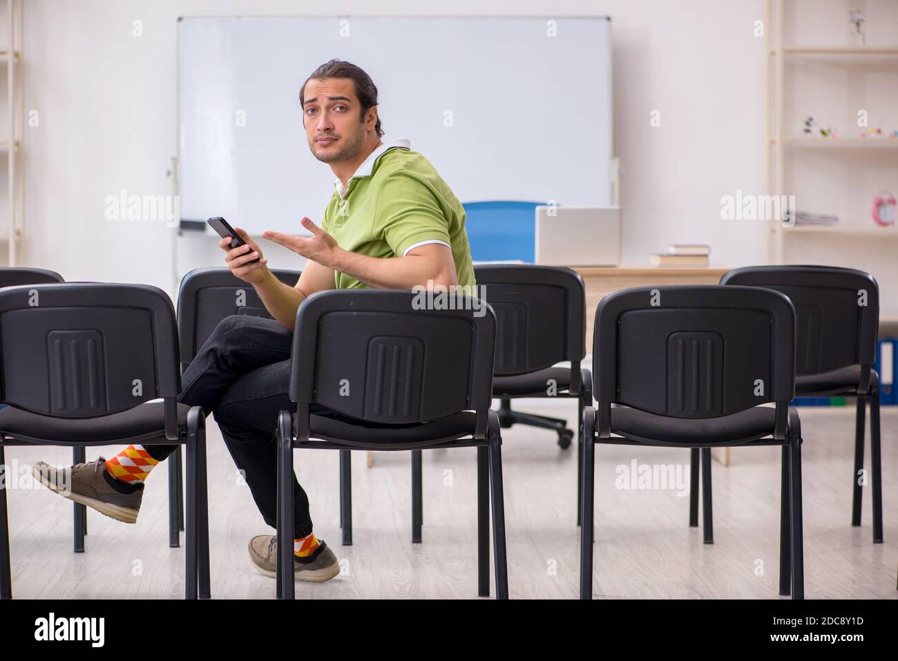 Young student in business presentation concept Stock Photo - Alamy