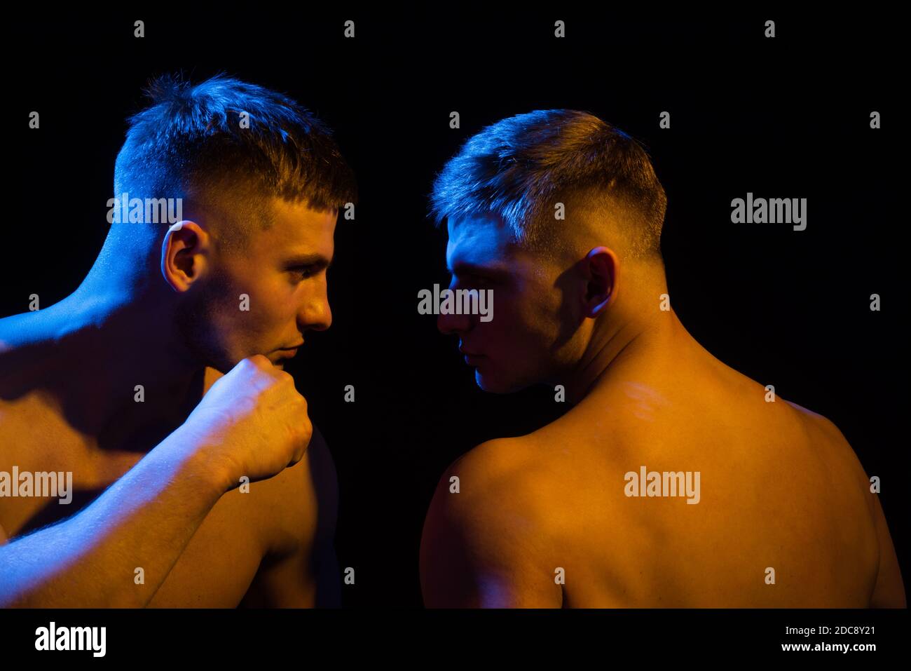 Two men rivalry, closeup of male face. Muscular men forces. Muscular ...