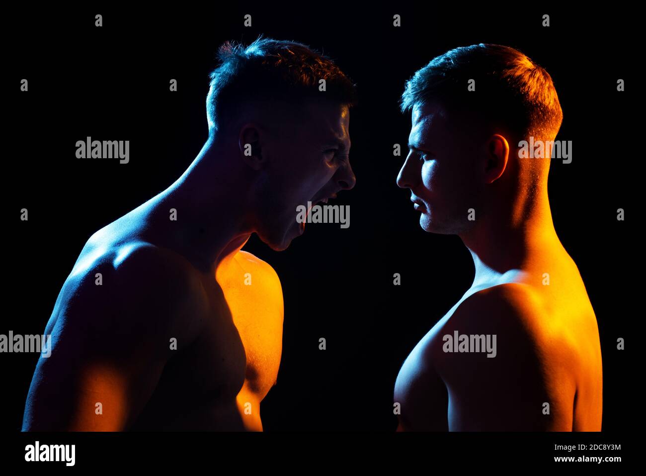 Screaming man. Two young angry people standing face to face Stock Photo ...