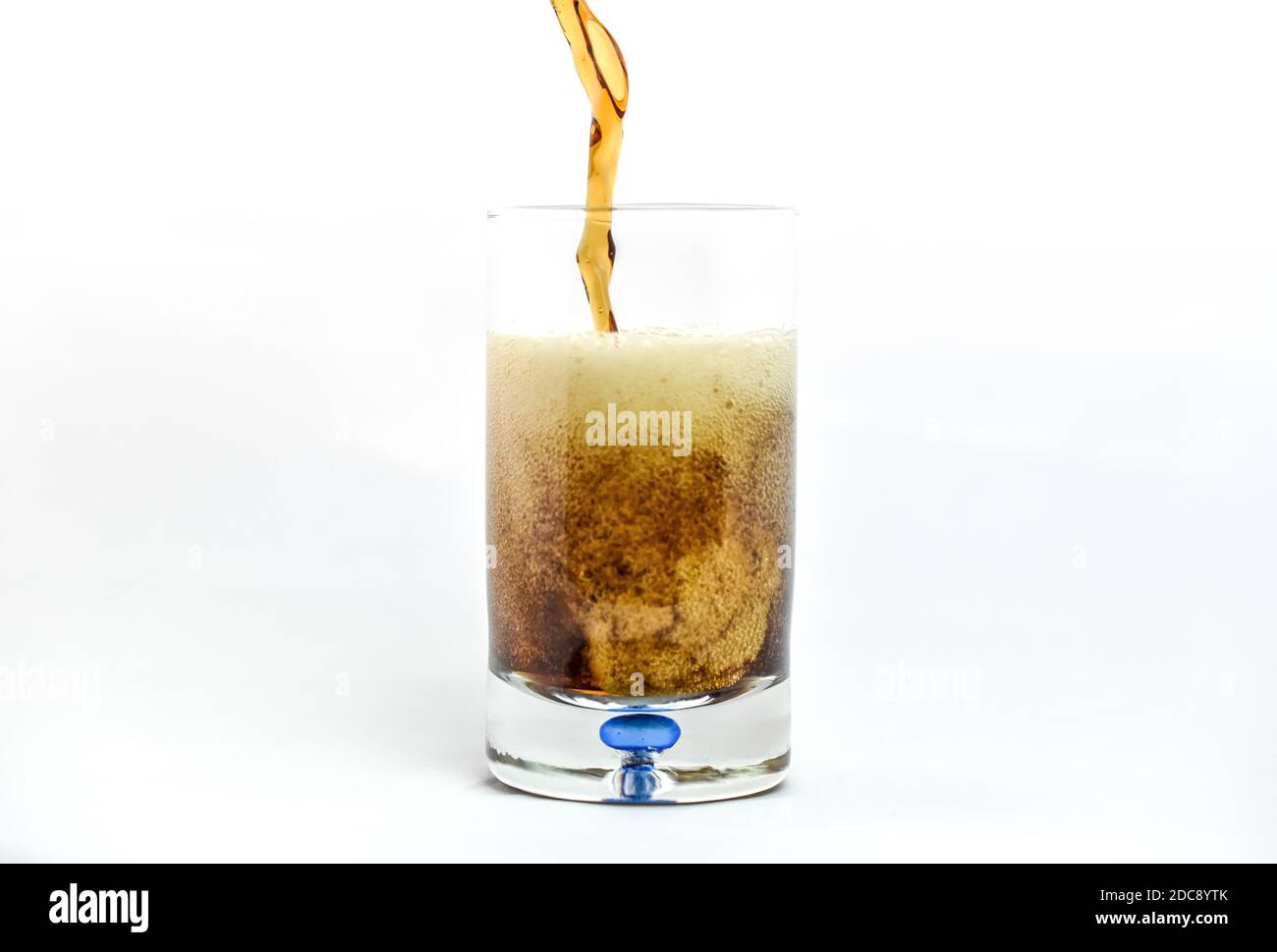 Pouring soda pop into clear glass Stock Photo - Alamy