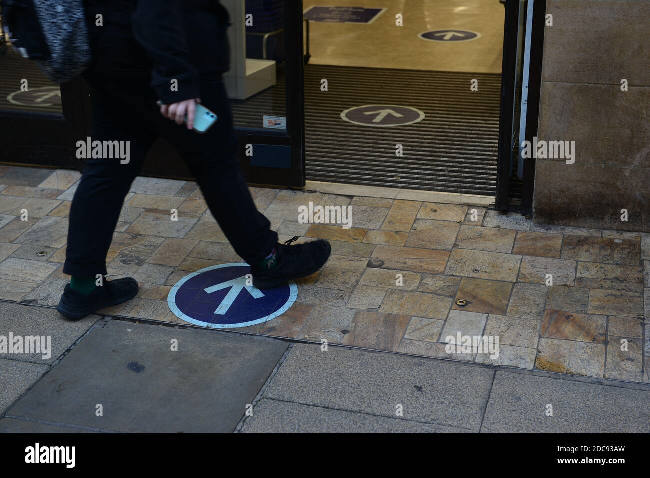 Cambridge Uk, , round arrows on floor, guiding people to walk in the ...