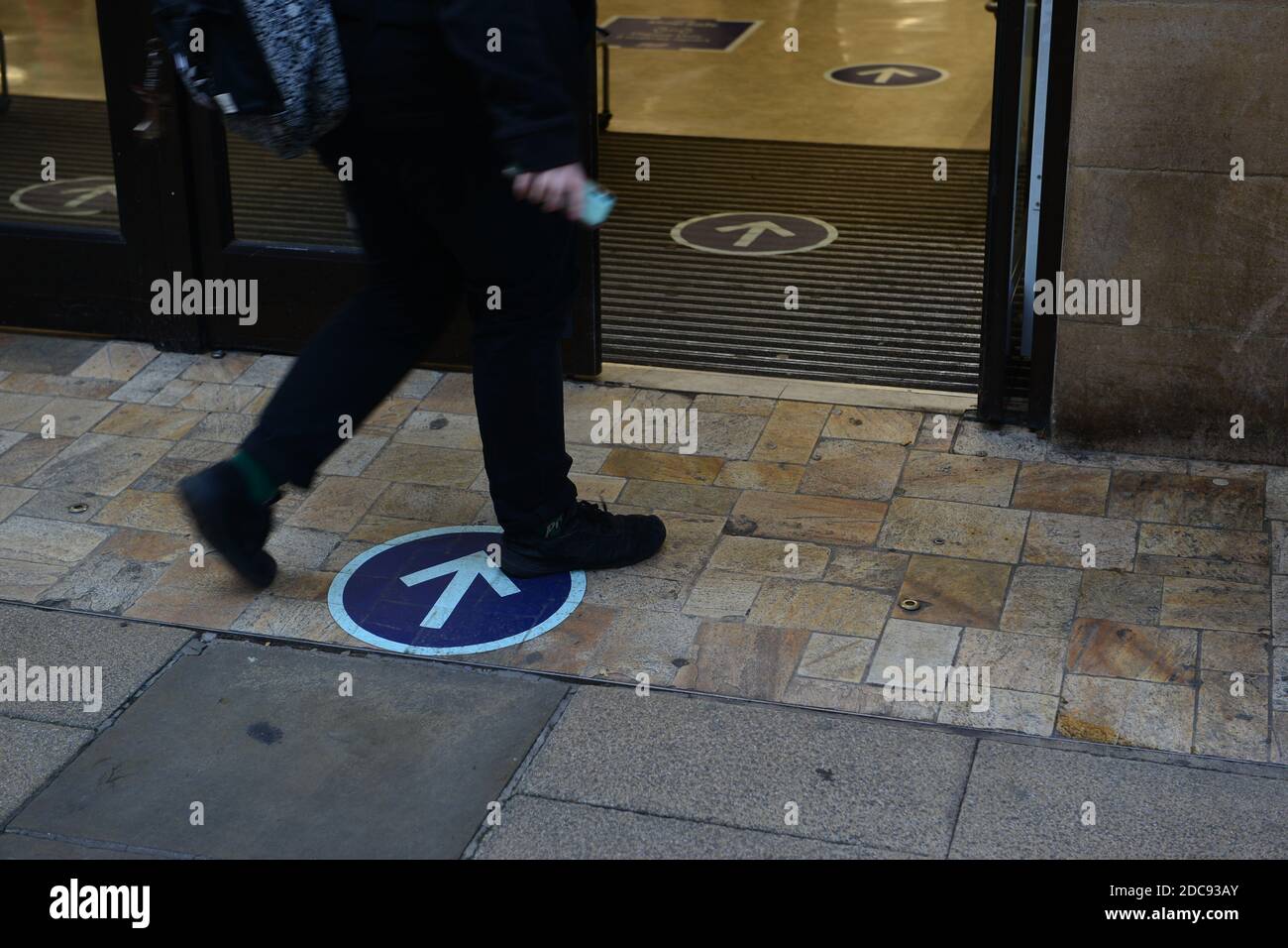Cambridge Uk, , round arrows on floor, guiding people to walk in the ...