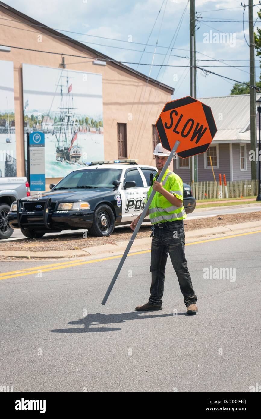 utility worker with stop go sign street in Pensacola Florida USA Stock ...