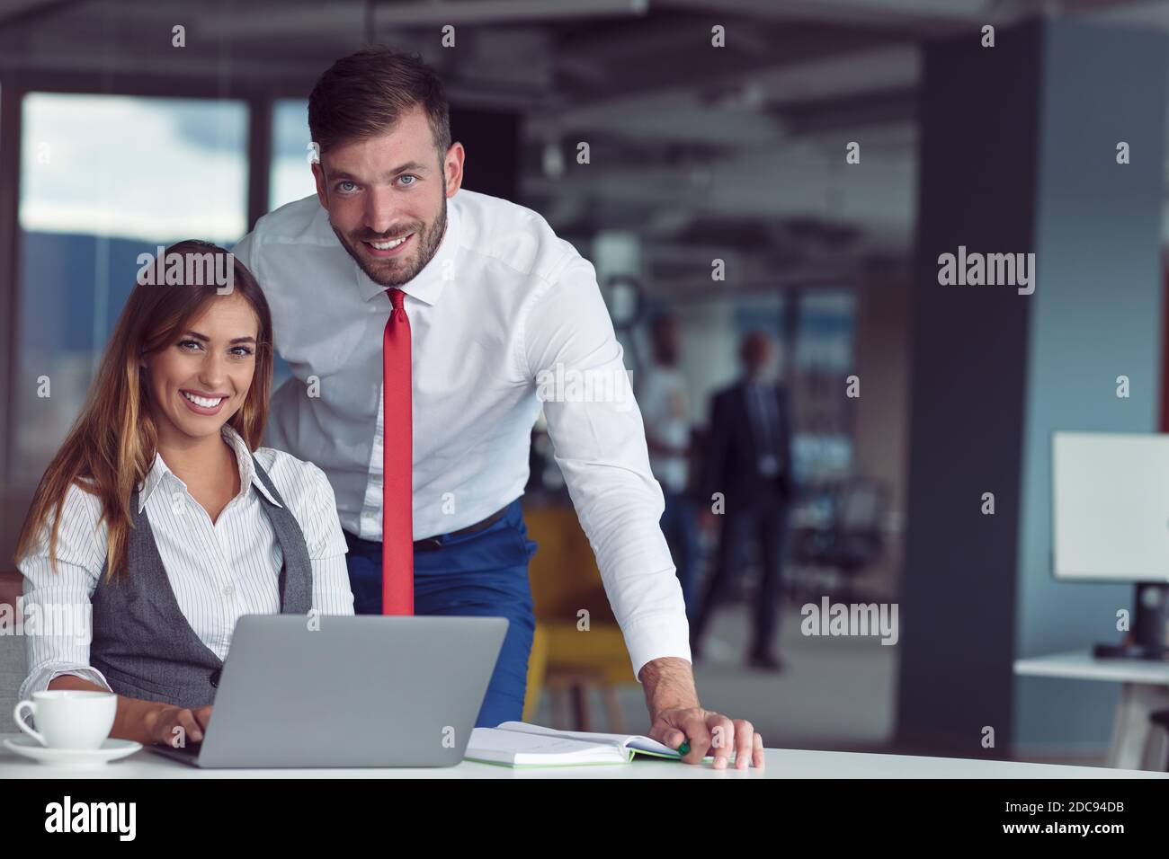 Young Business people working together on computer Stock Photo - Alamy