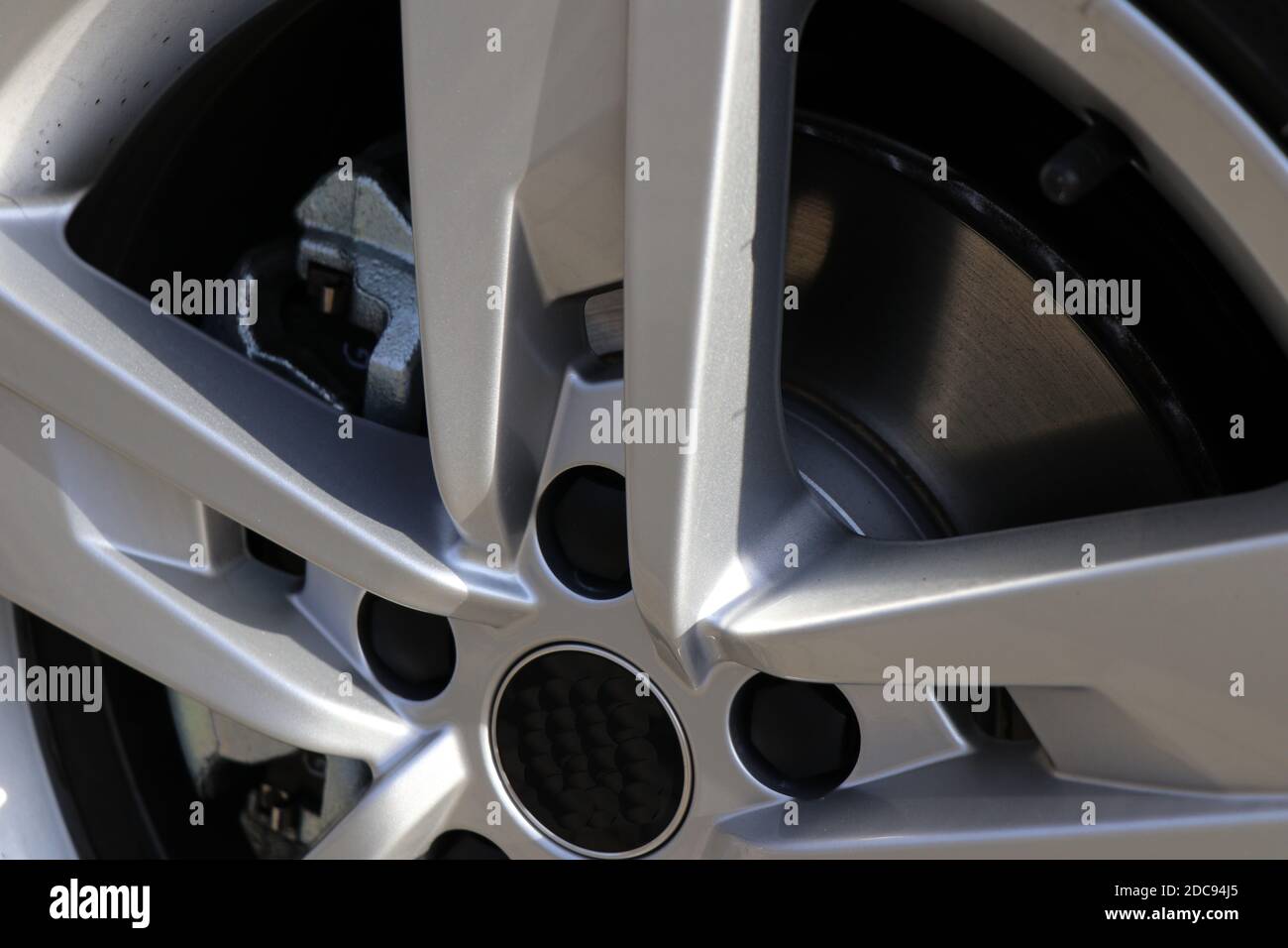 Closeup view on an alloy wheel with brake disc Stock Photo - Alamy
