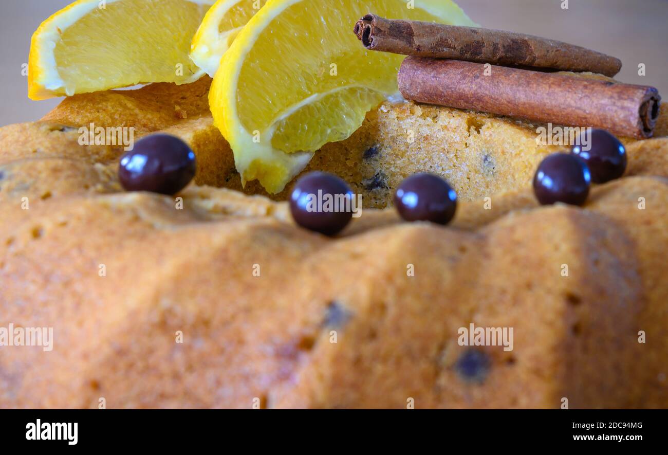 zoom on Orange and cinnamon round cake Stock Photo - Alamy