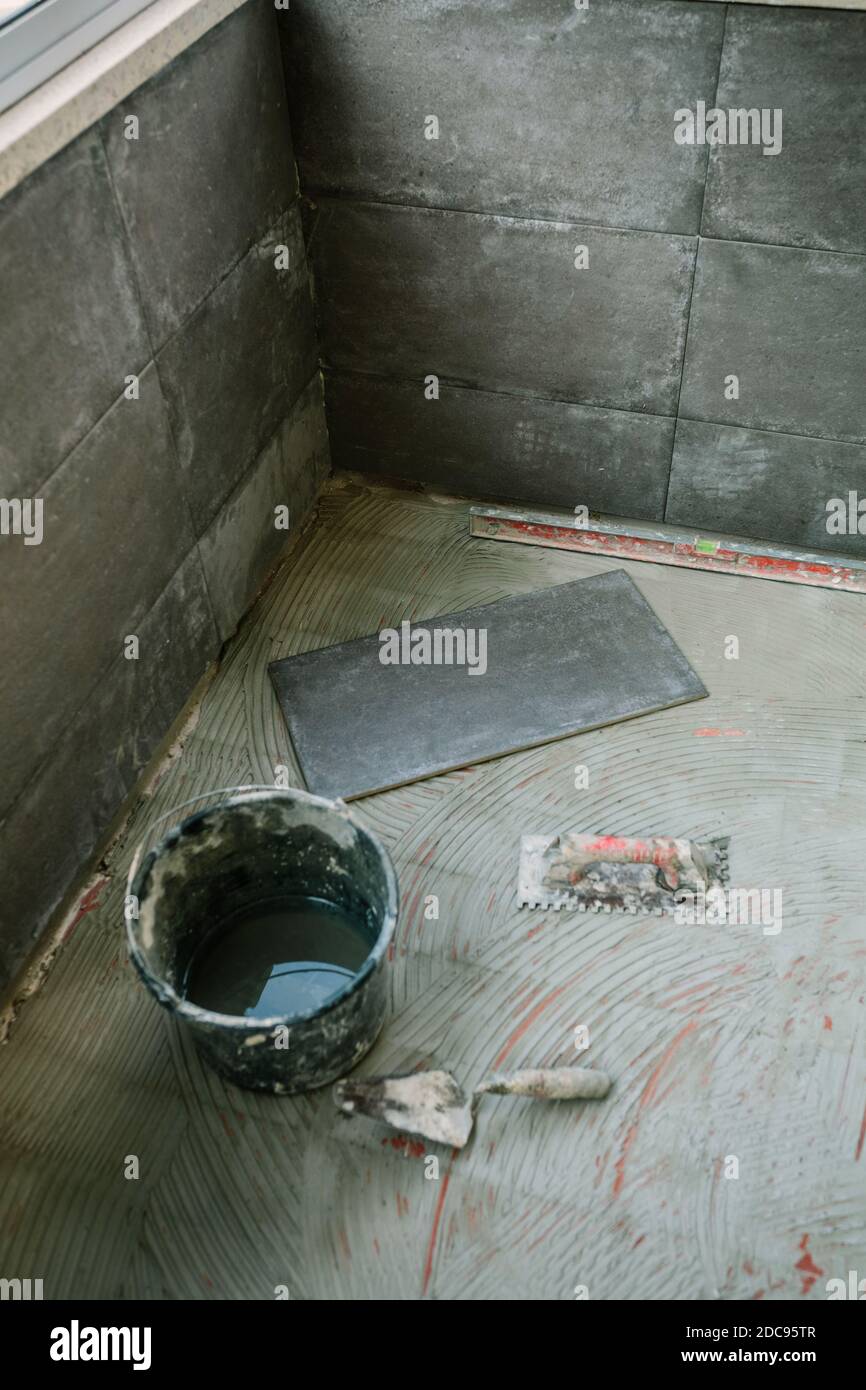 Tile laying work on floor Stock Photo - Alamy