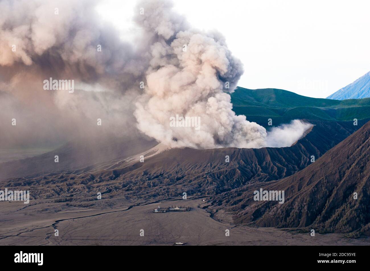 Mount Bromo Erupting at Sunrise Sending Ash Clouds High into the Sky ...