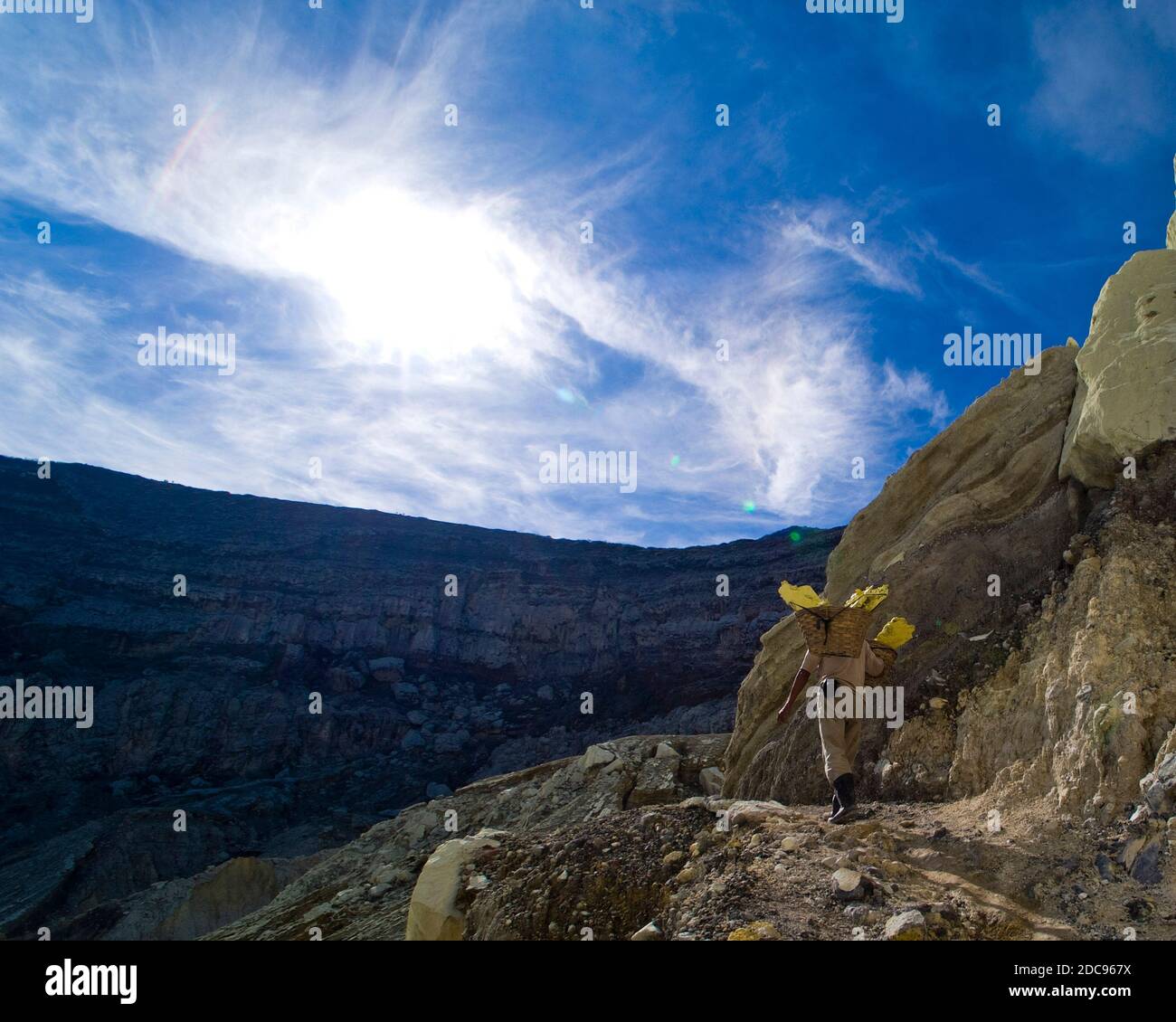 Man carrying sulphur from volcano hi-res stock photography and images ...